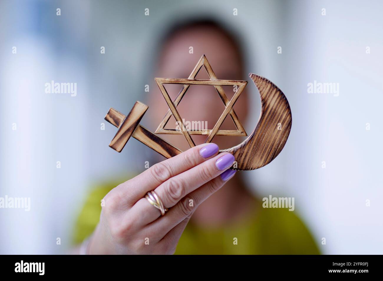 Religious symbols in hand. Jewish Star of David, Muslim star and ...