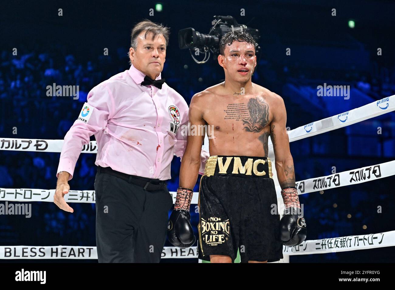 Tokyo, Japan. 13th Oct, 2024. Referee Laurence Cole, left, stops the ...
