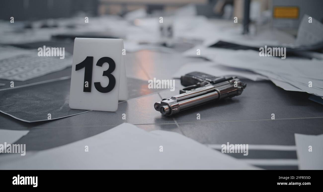 Close up shot of murder weapon lying next to numbered marker at crime ...
