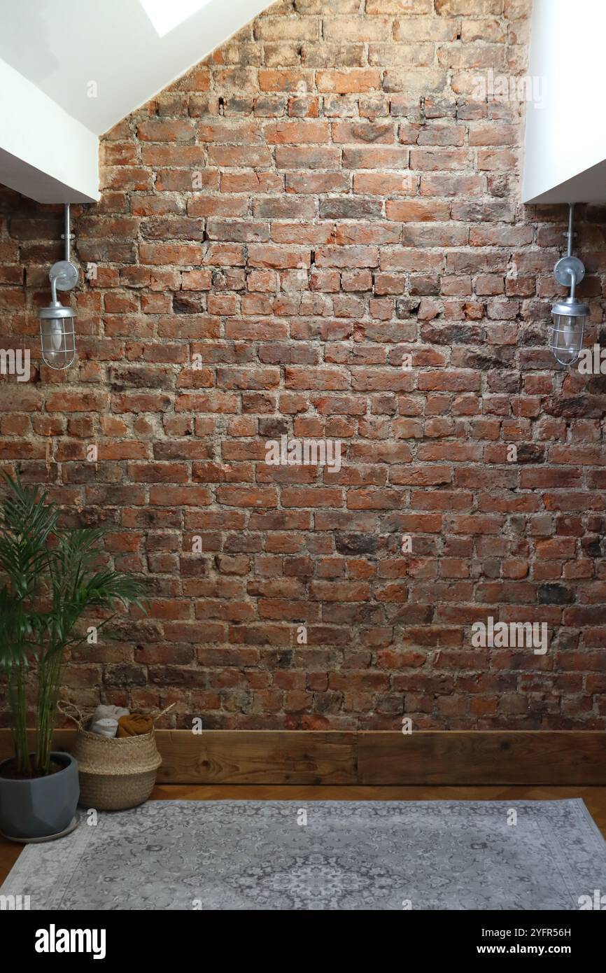 Minimalist Brick Wall Interior with Ceiling Lights, Potted Plant, and ...