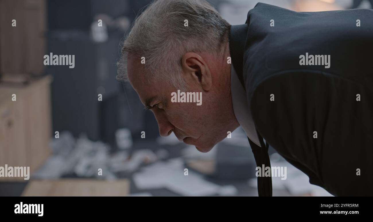 Office robbery or murder case: Close up of male detective in suit ...