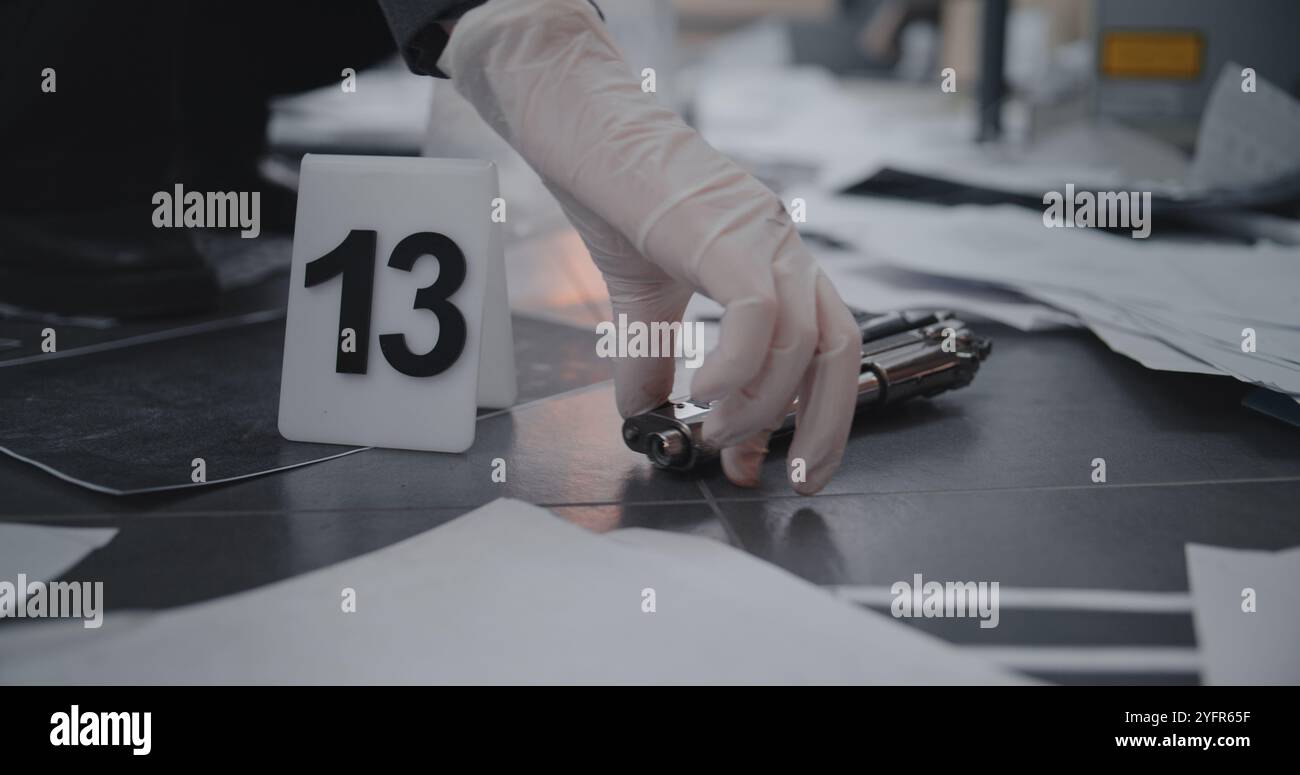 Close up shot of murder weapon lying next to numbered marker at crime ...