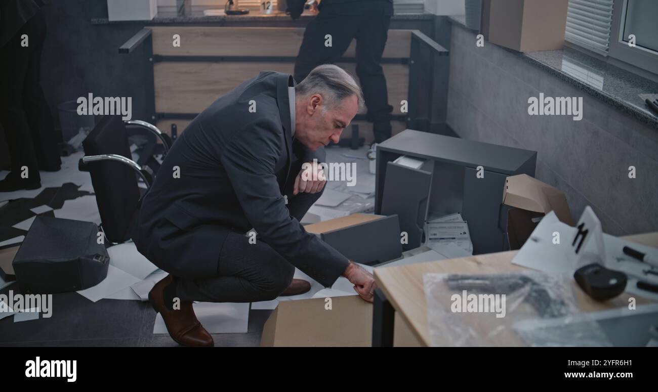 Office robbery or murder case: Crime investigation team working. Male ...