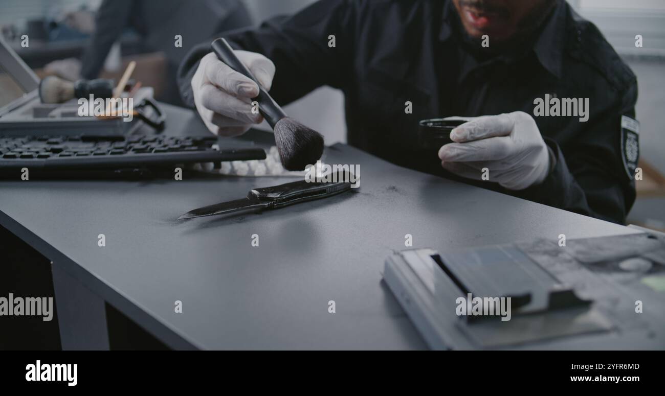 Murder case: Close up of African American police criminalist searching ...