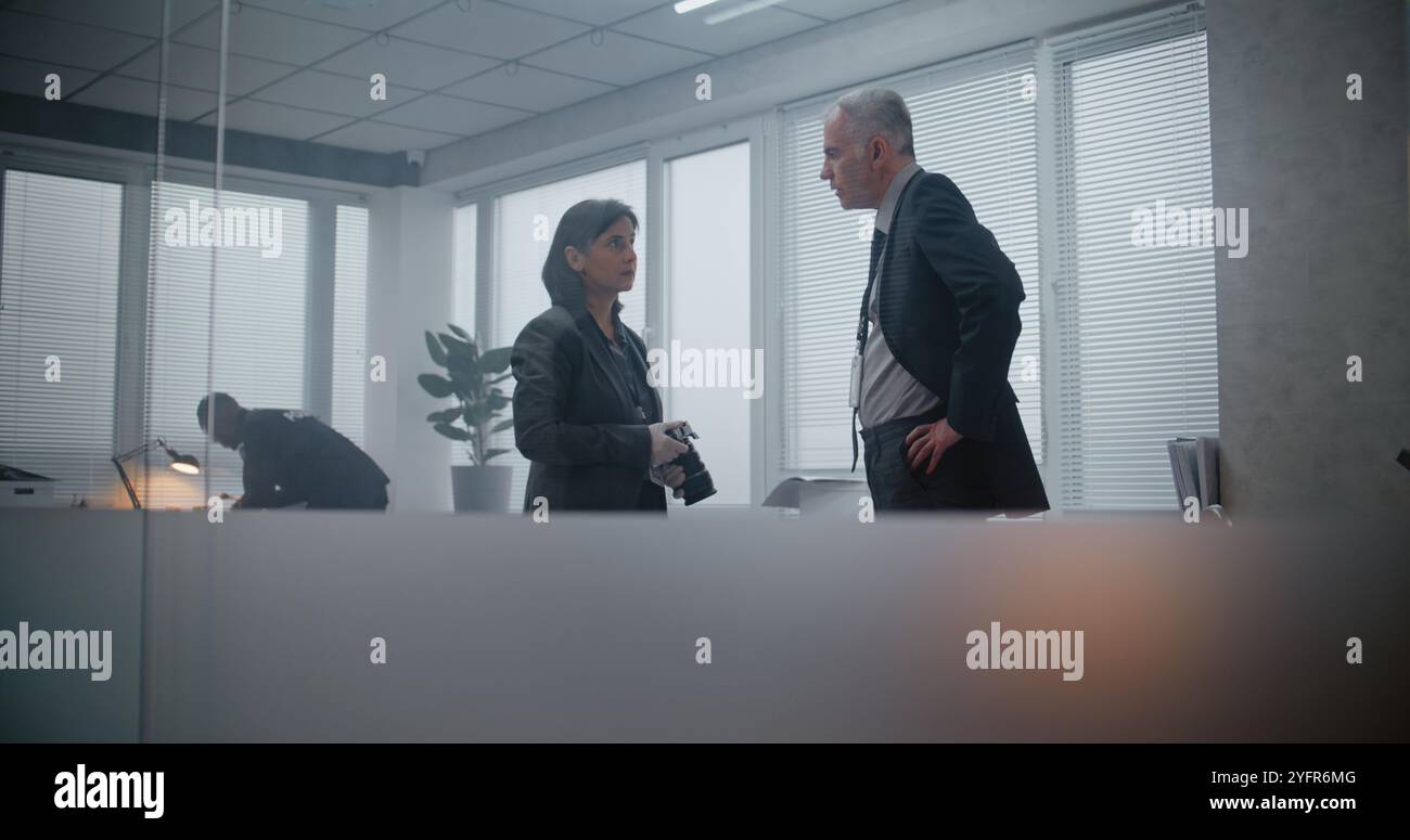 Office robbery case: Female criminalist with professional camera ...