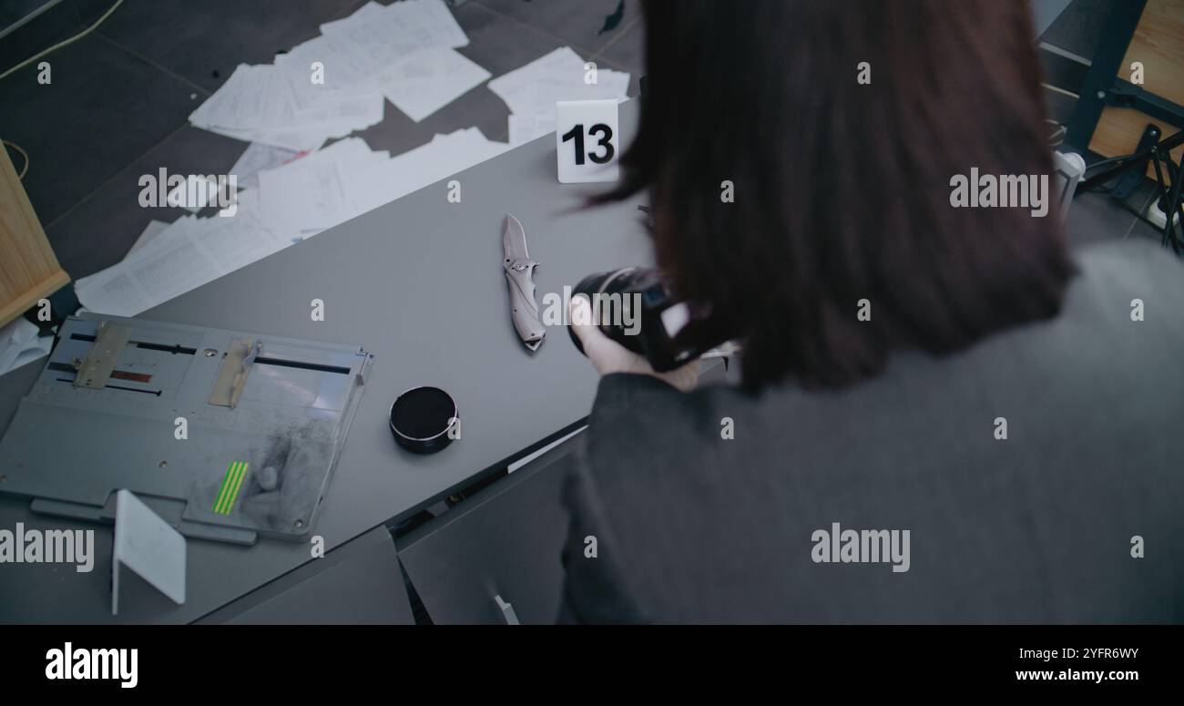 Robbery or murder case: Top view on female criminalist taking photos of ...