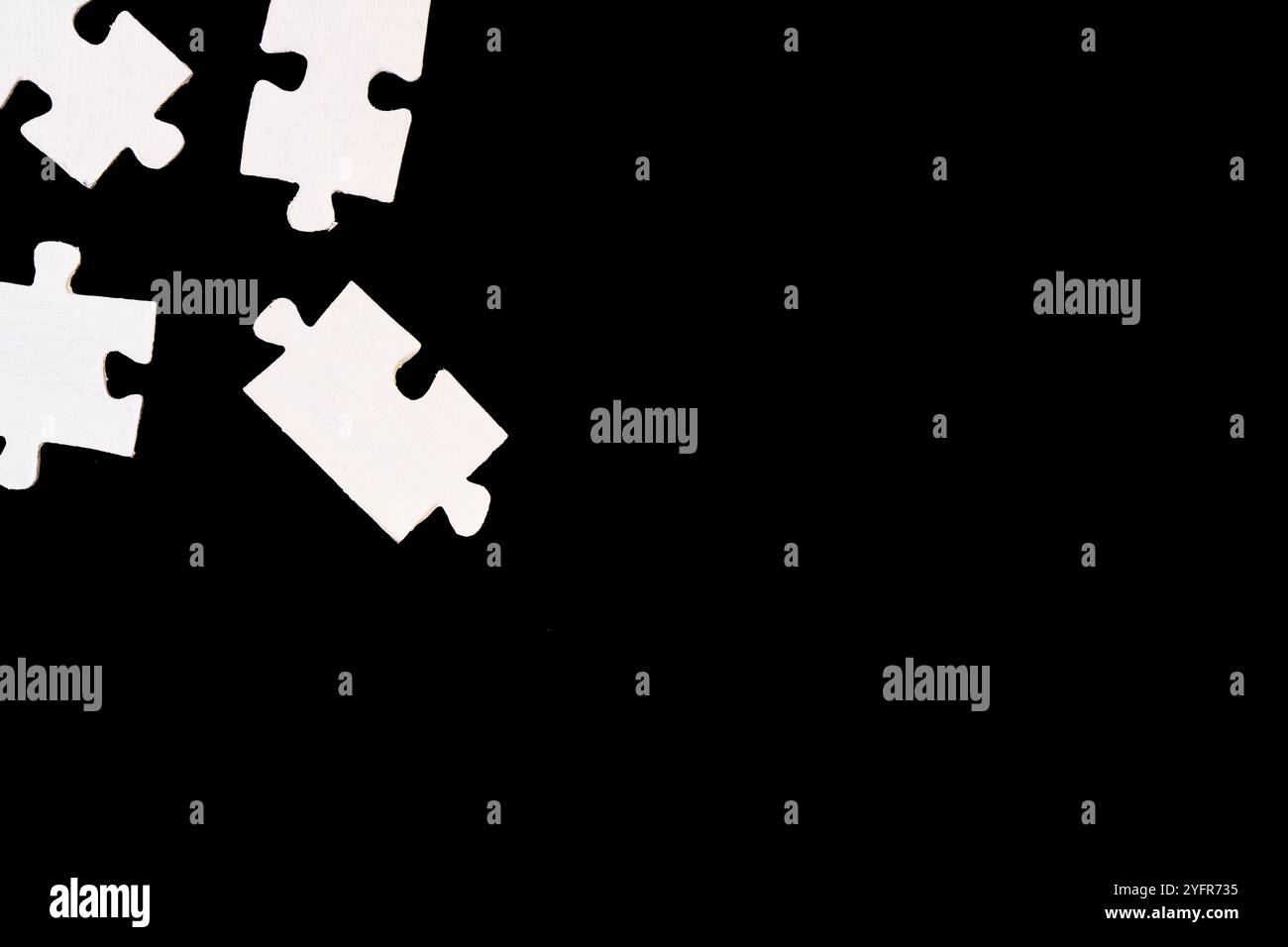 Simplicity and challenge: puzzle pieces on a minimalist background ...