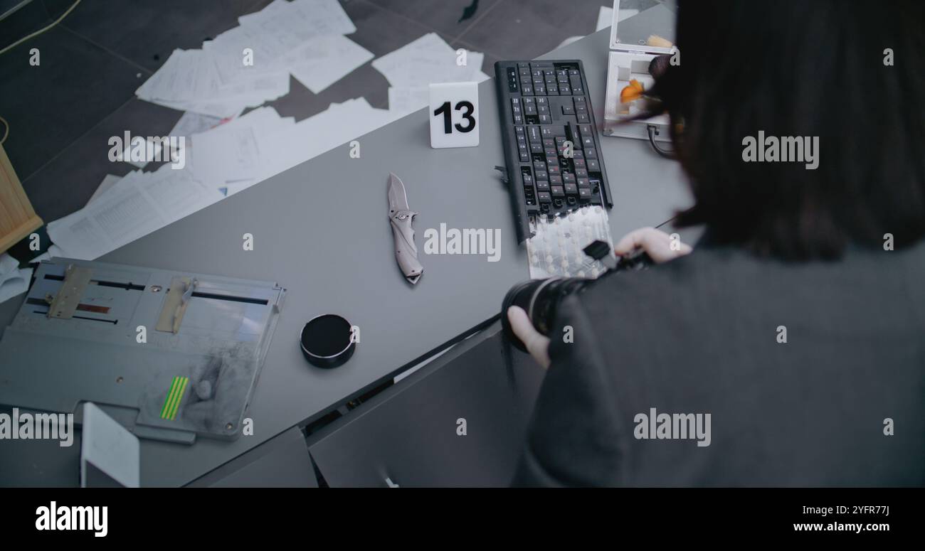 Robbery or murder case: Top view on female criminalist taking photos of ...