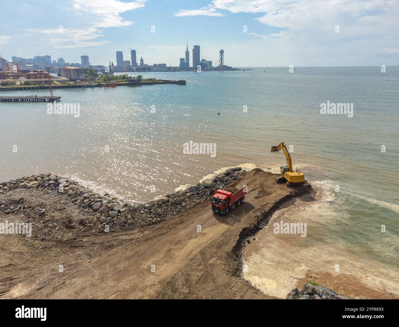 Excavator working sand playground hi-res stock photography and images ...