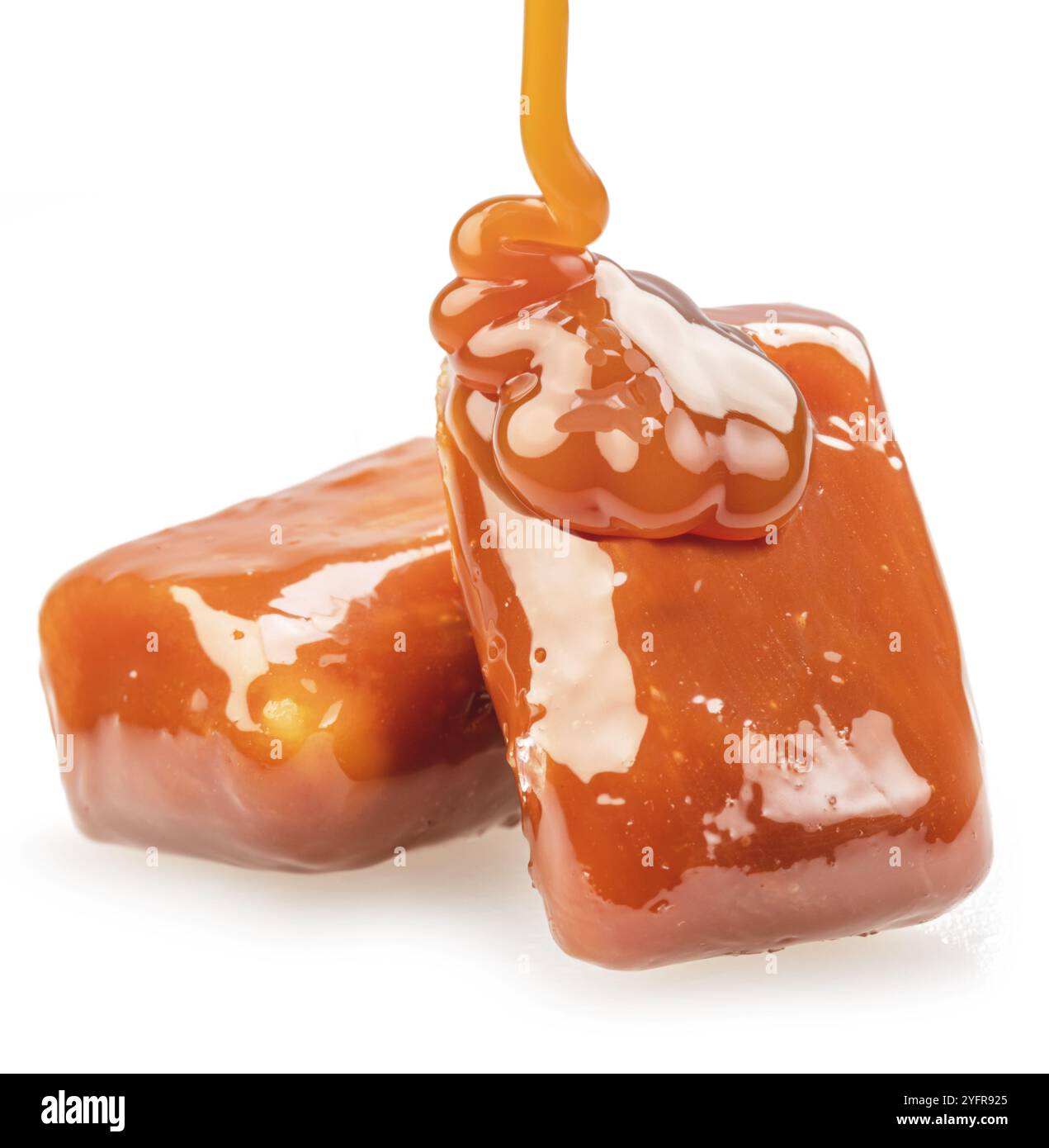 Caramel candies covered with melt caramel isolated on white background ...