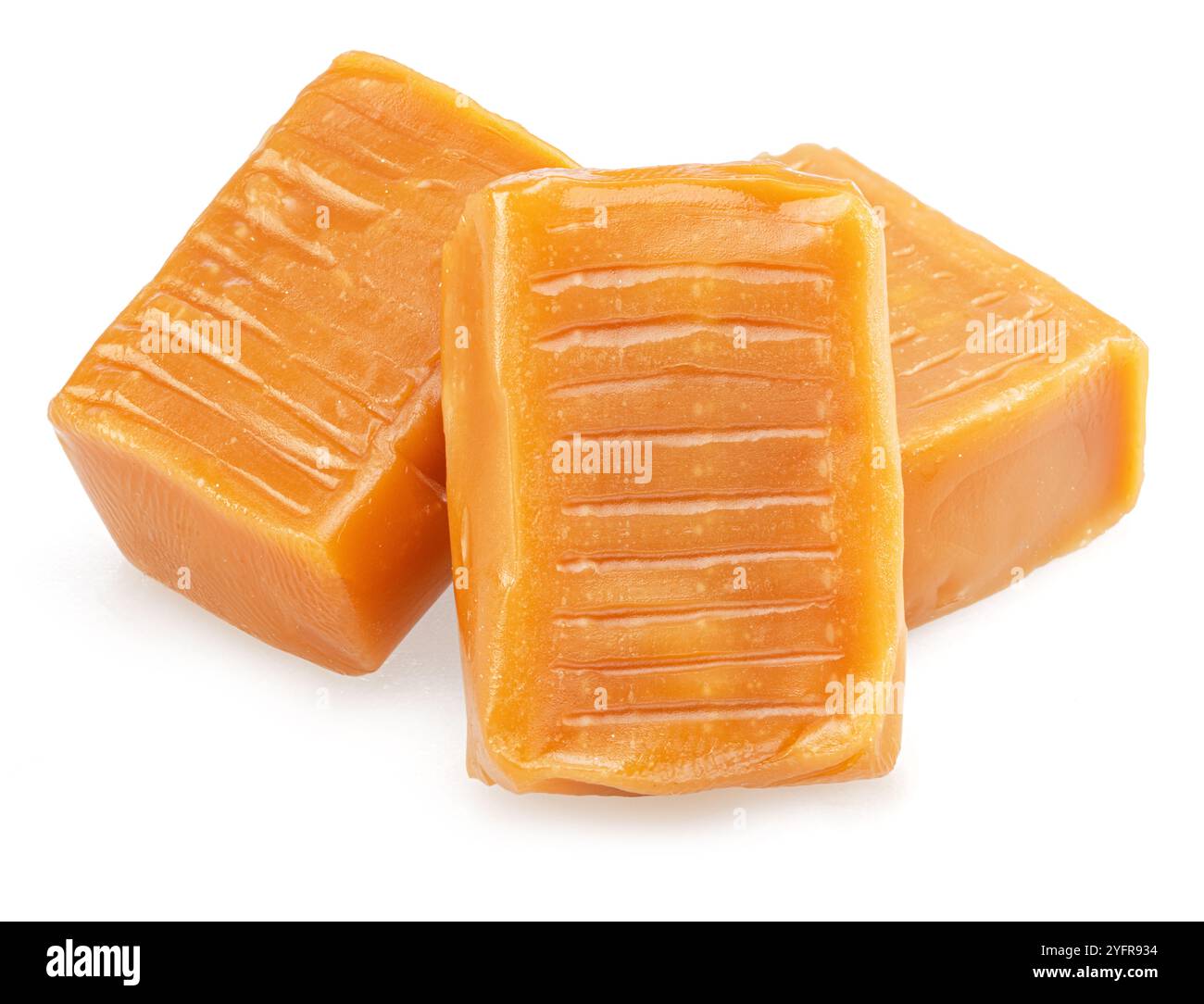 Milk caramel candies isolated on white background Stock Photo - Alamy