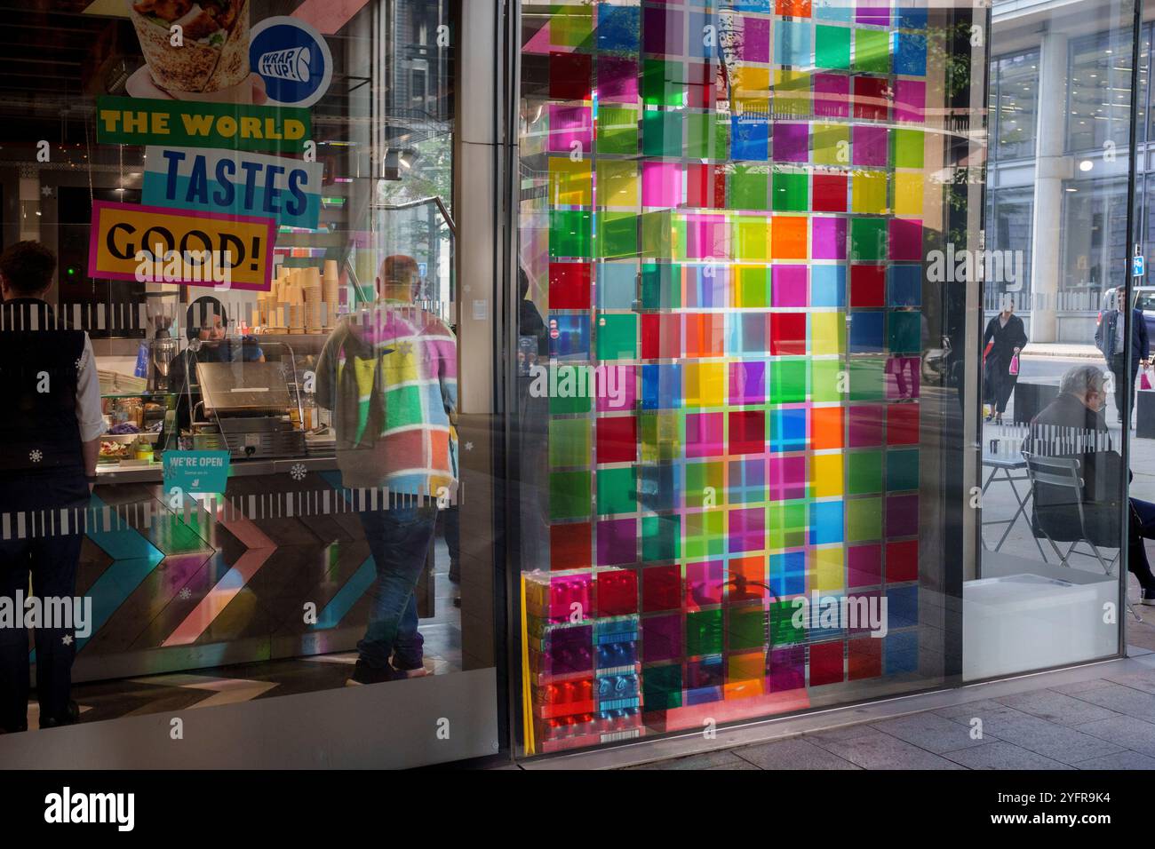 Coloured window tiles on the window of a takeaway business on Wood ...