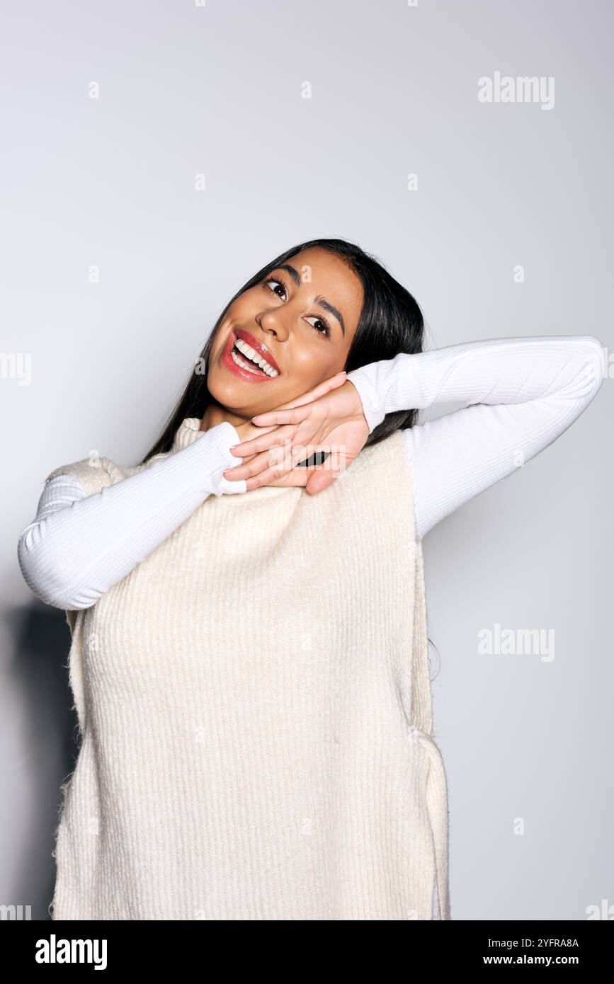 A young woman with long hair beams with joy, showcasing her radiant ...