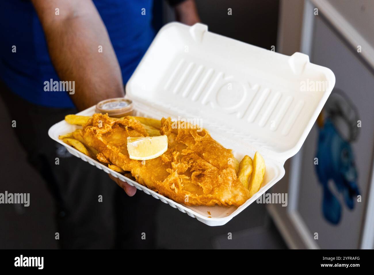 fish and chips in a takeaway container Stock Photo - Alamy