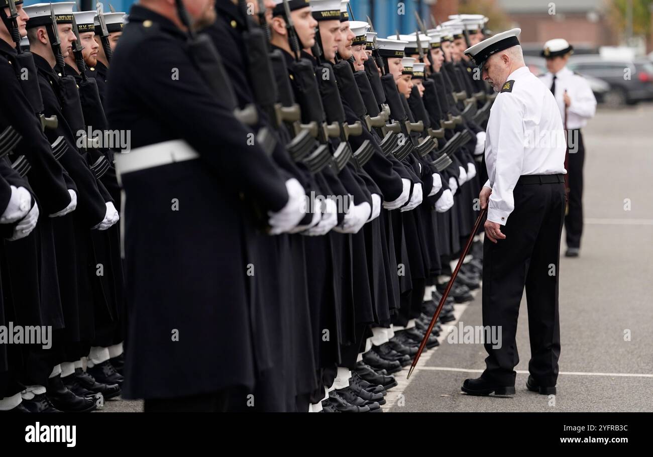 A Royal Navy State Ceremonial Instructor measures the distance between ...