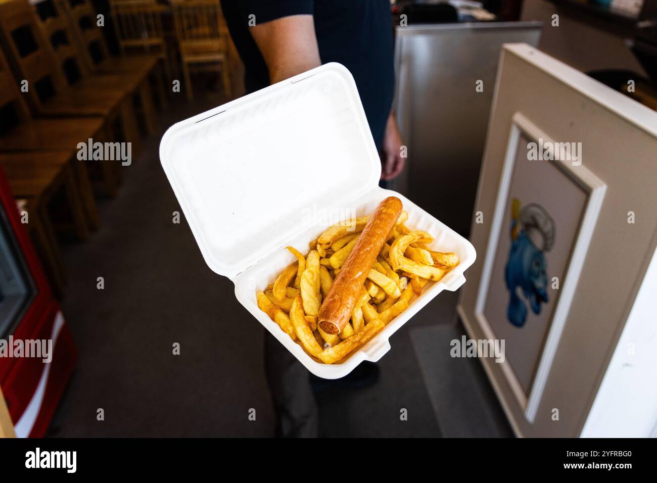 chips and a foot long sausage Stock Photo - Alamy