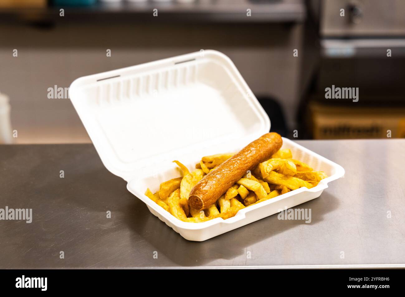 chips and a foot long sausage Stock Photo - Alamy