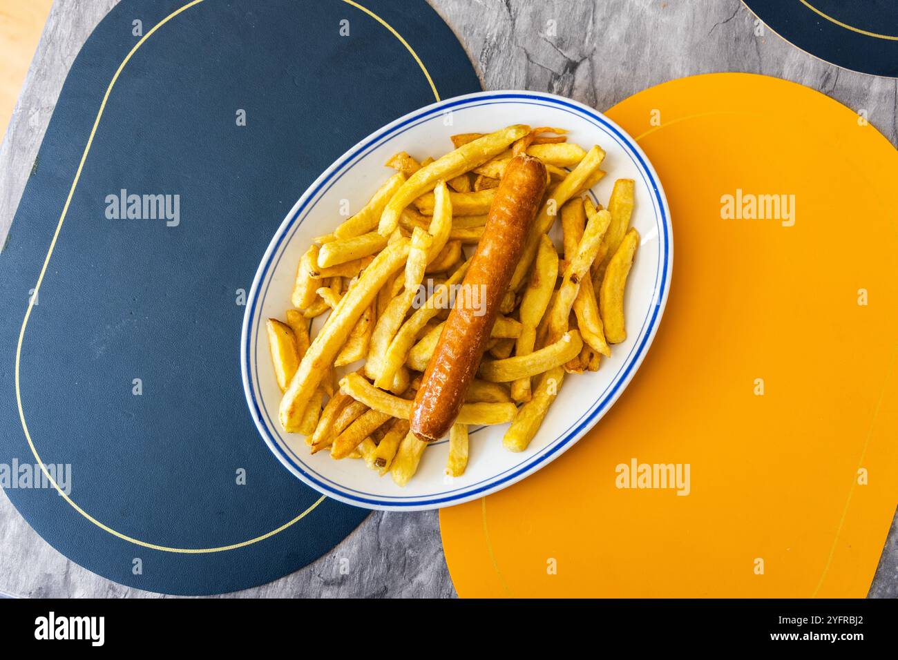 chips and a foot long sausage Stock Photo - Alamy