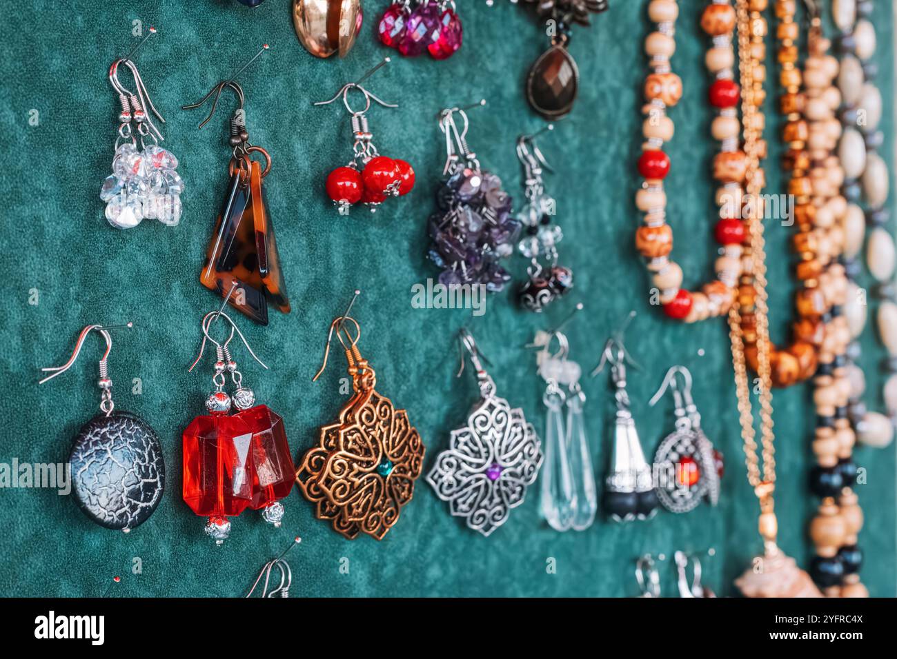 Colorful jewelry and accessories displayed at a market, showcasing ...