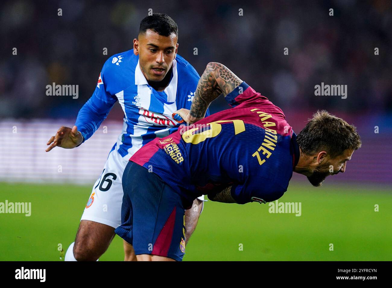 Inigo Martinez of FC Barcelona and Walid Cheddira of RCD Espanyol ...