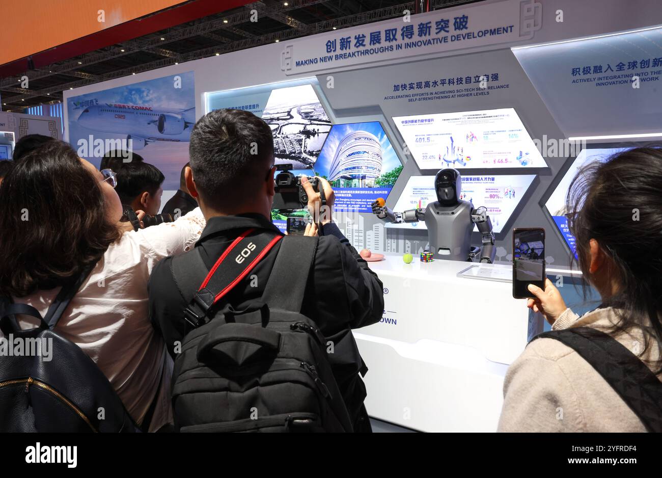 Shanghai. 5th Nov, 2024. People take photos at the China Pavilion ...