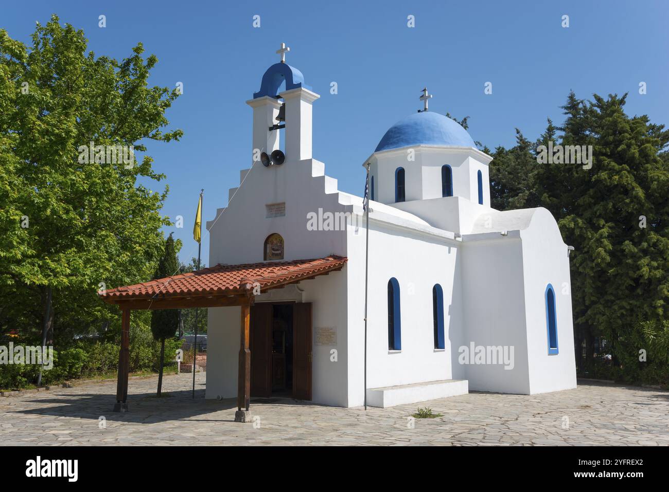 White Greek church with blue domes under a clear sky, Church of the ...