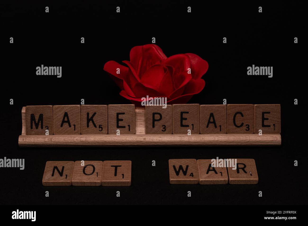 Scrabble wooden letter tile holder with text saying make peace not war ...