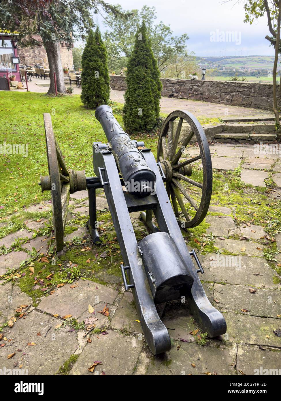 Historical field cannon with the year 1875 on a decorated cannon barrel ...