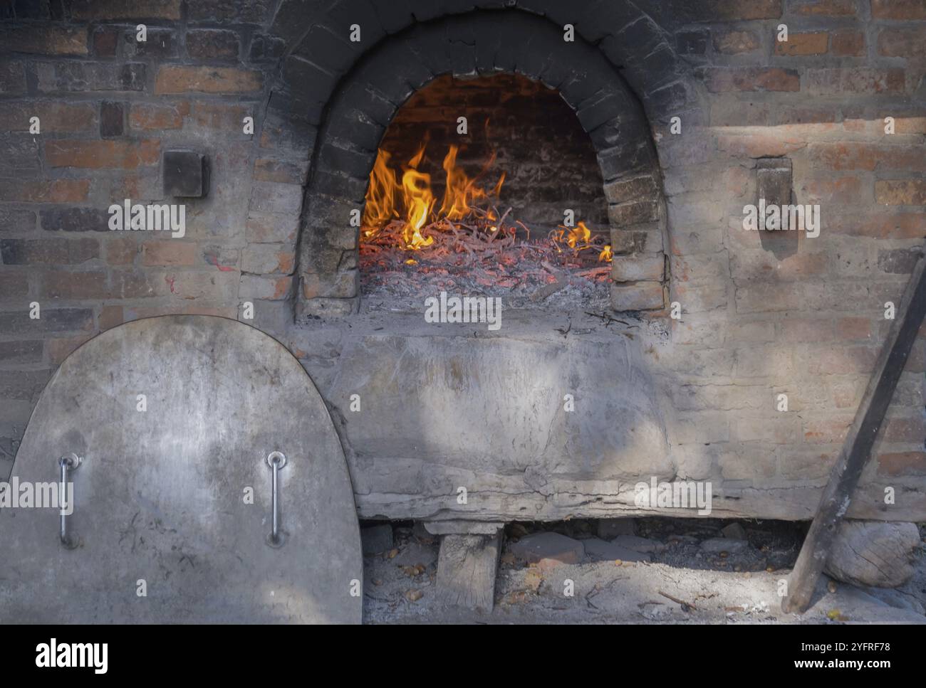 Firing up a traditional bread oven, Muensterland, North Rhine ...