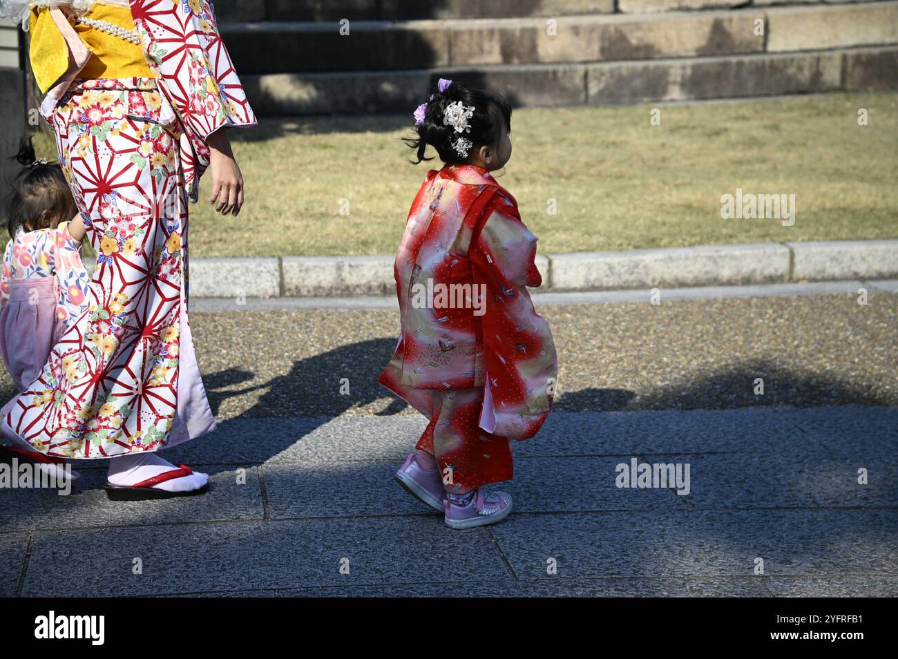 Portrait of a little girl wearing a traditional Japanese Kimono costume ...