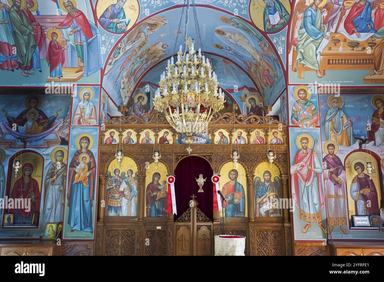 Interior view of an Orthodox church with icons and a large golden chandelier, Church of the ...