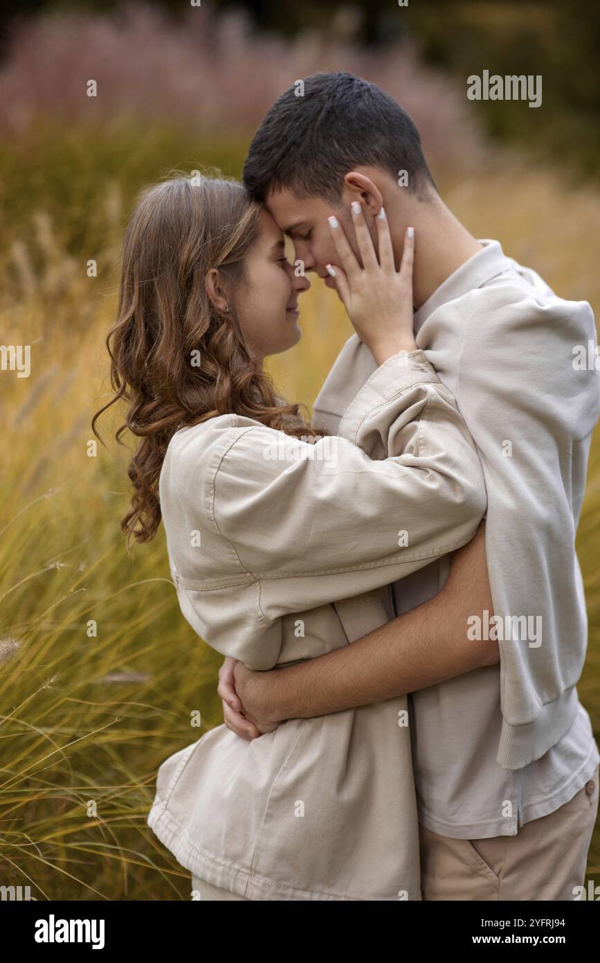 Young Cute Female Hugs Boyfriend. In Autumn Outdoor. Lovers Walking in Park. Attractive Funny ...