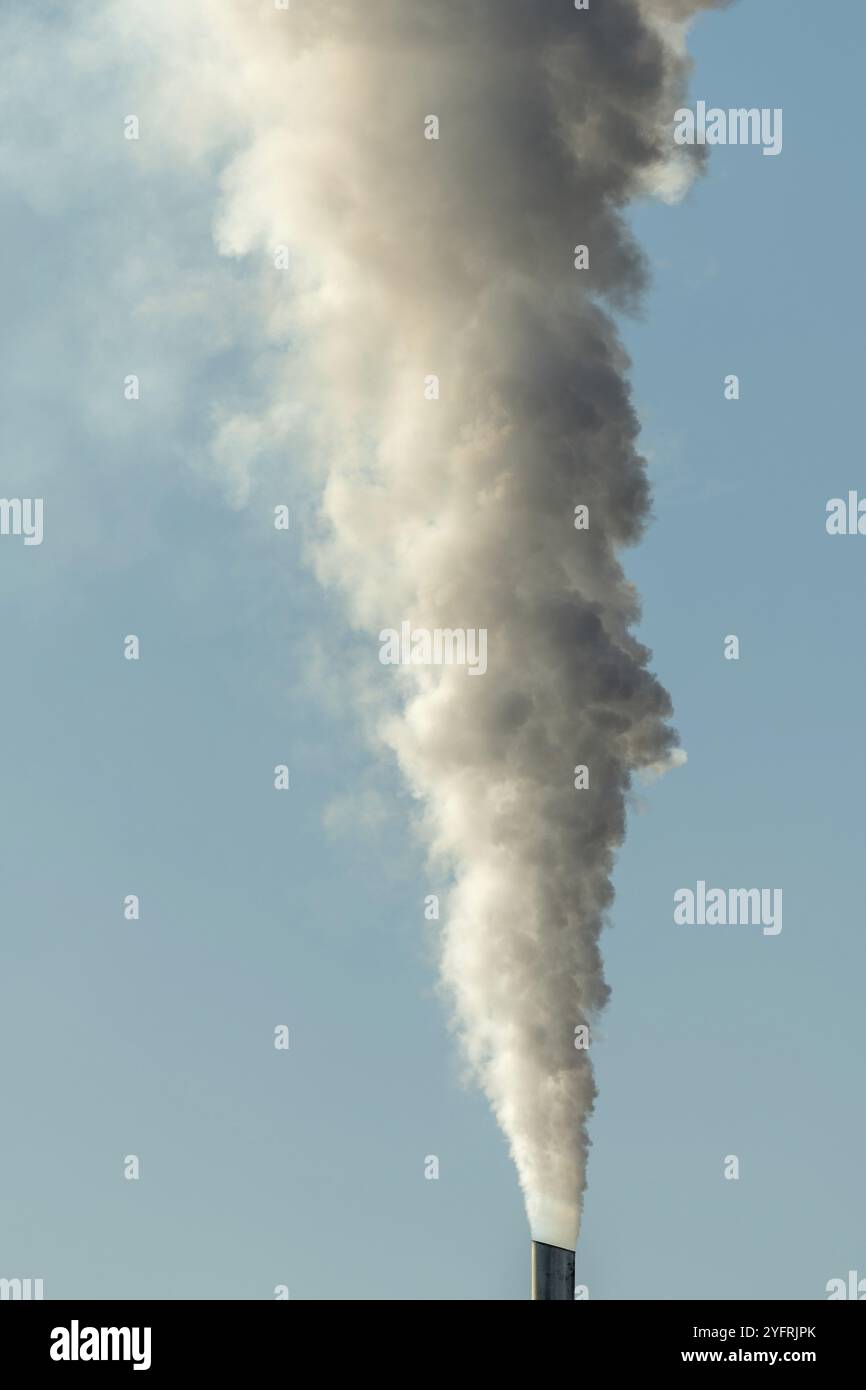 Column of smoke coming out of an industrial chimney. France Stock Photo ...