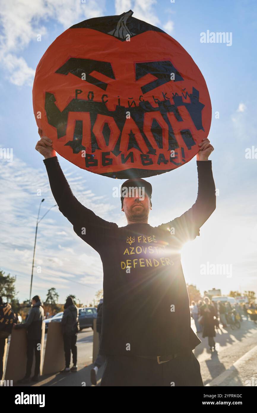 Ukrainian artist demonstrating with a poster "Captivity Kills" at ...