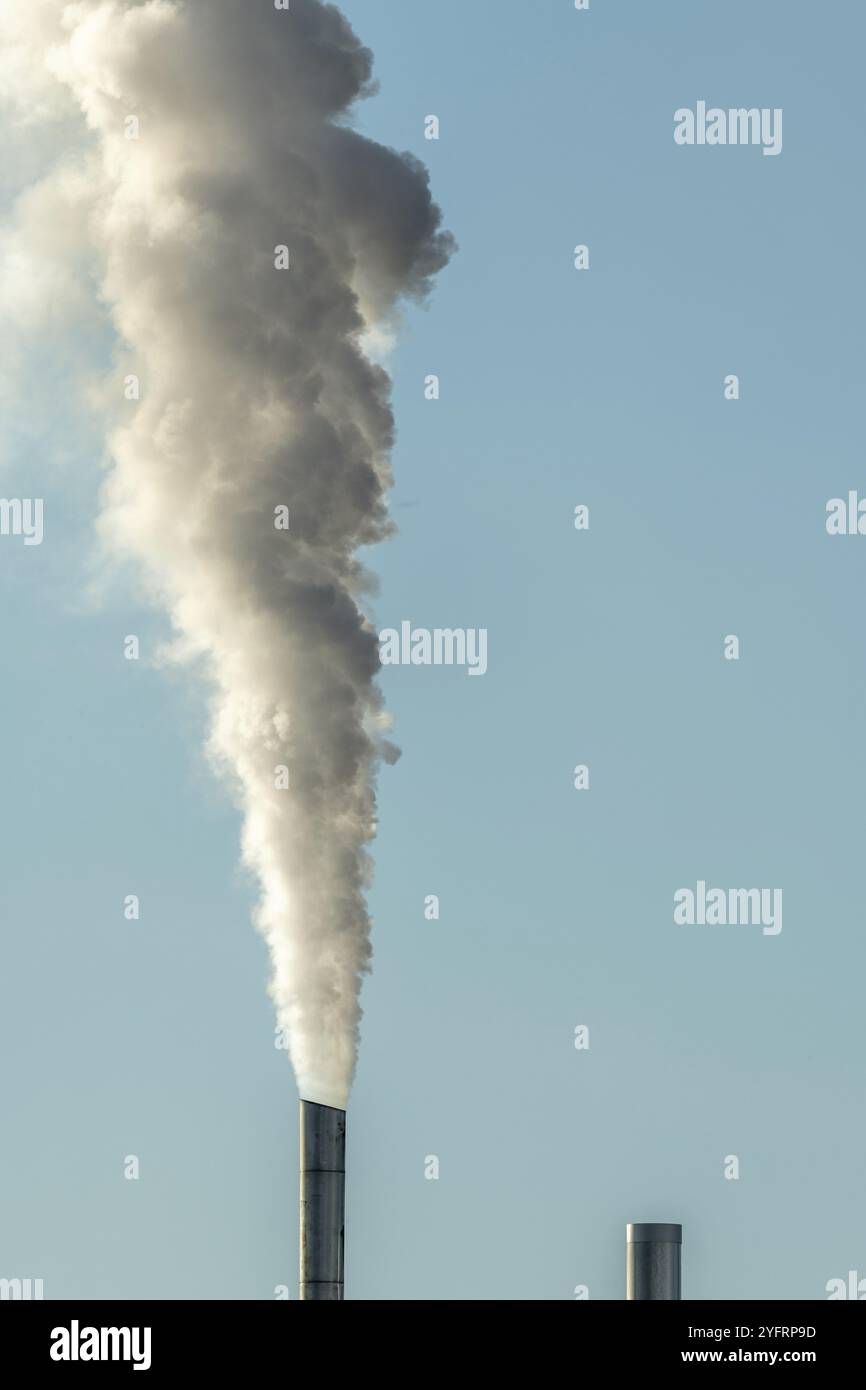 Column of smoke coming out of an industrial chimney. France Stock Photo ...