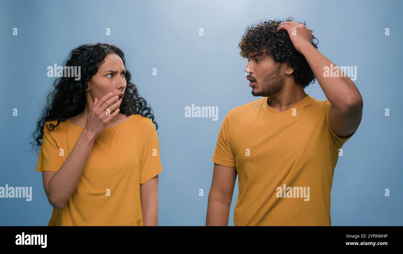 Multiracial shocked scared afraid couple amazed shocked Hispanic woman ...