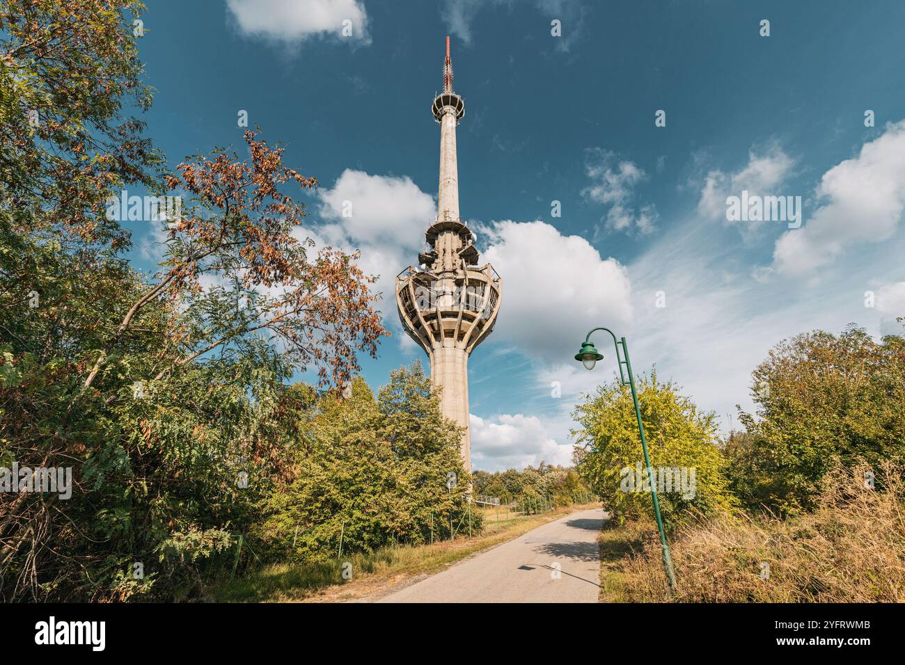 The remnants of an old, destroyed TV tower stand amidst the trees in ...