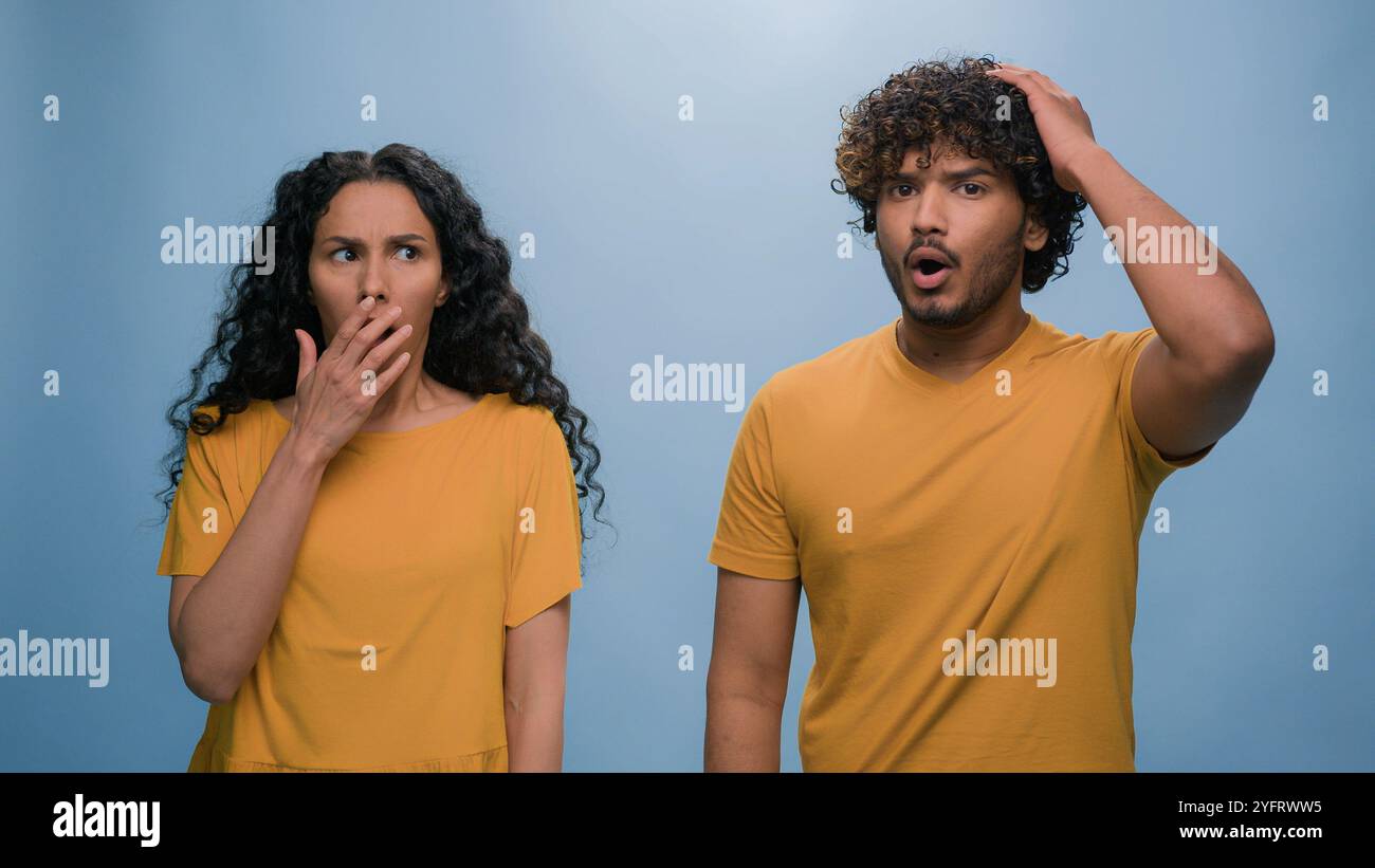 Multiracial shocked scared afraid couple amazed shocked Hispanic woman ...
