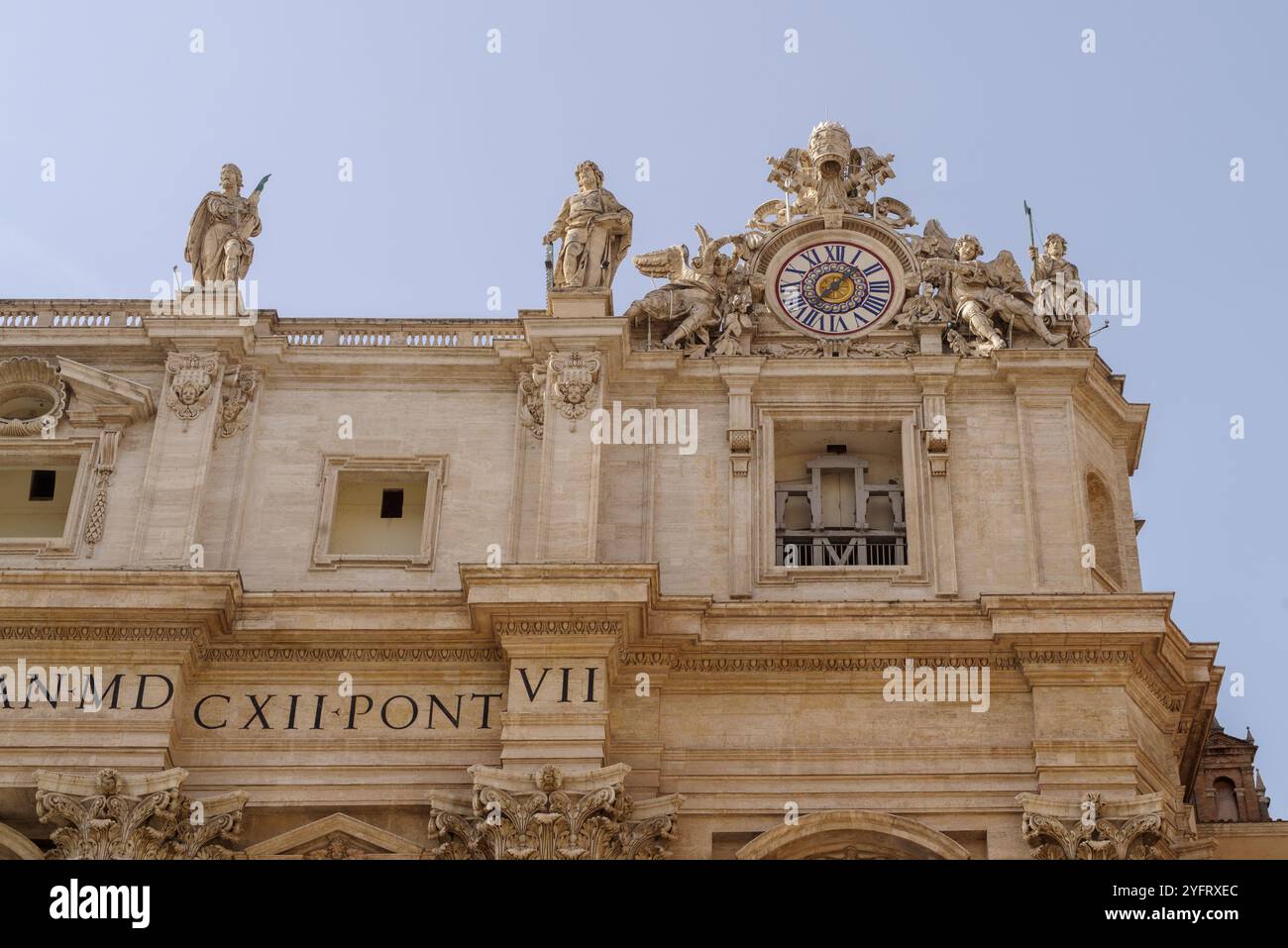 A low angle view of the clock tower atop St. Peter's Basilica in ...