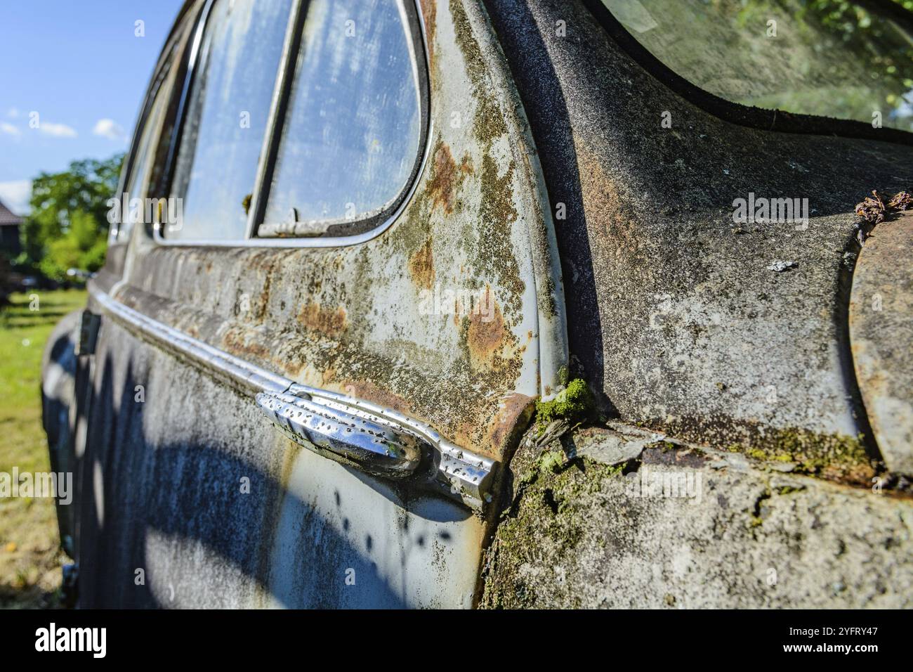 Old car rolled for scrapping in a meadow. Alsace, France, Europe Stock ...