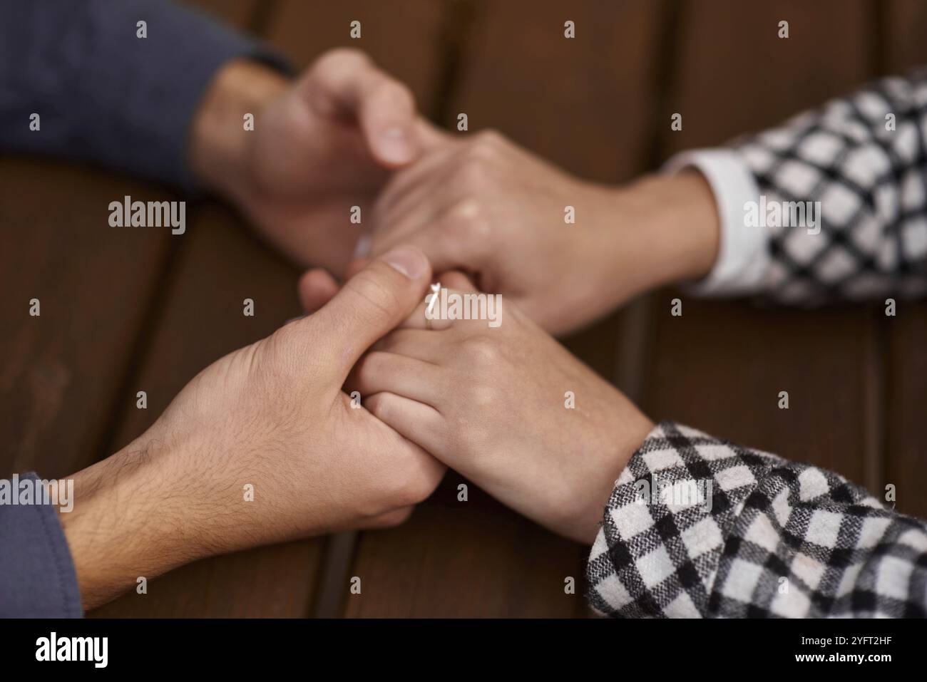 Close-Up: Loving Couple's Hands on the Table. intimacy, love and ...