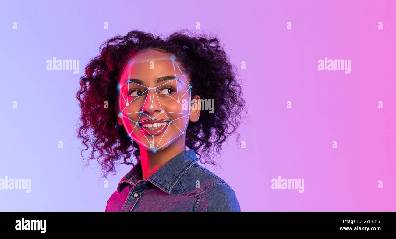 Young woman smiles during indoor facial recognition testing Stock Photo ...