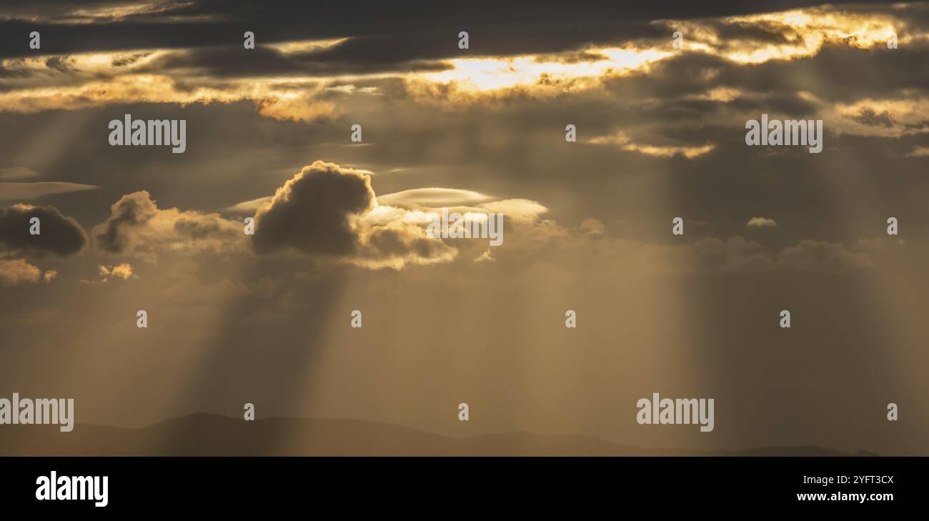 Suns rays through clouds hi-res stock photography and images - Alamy