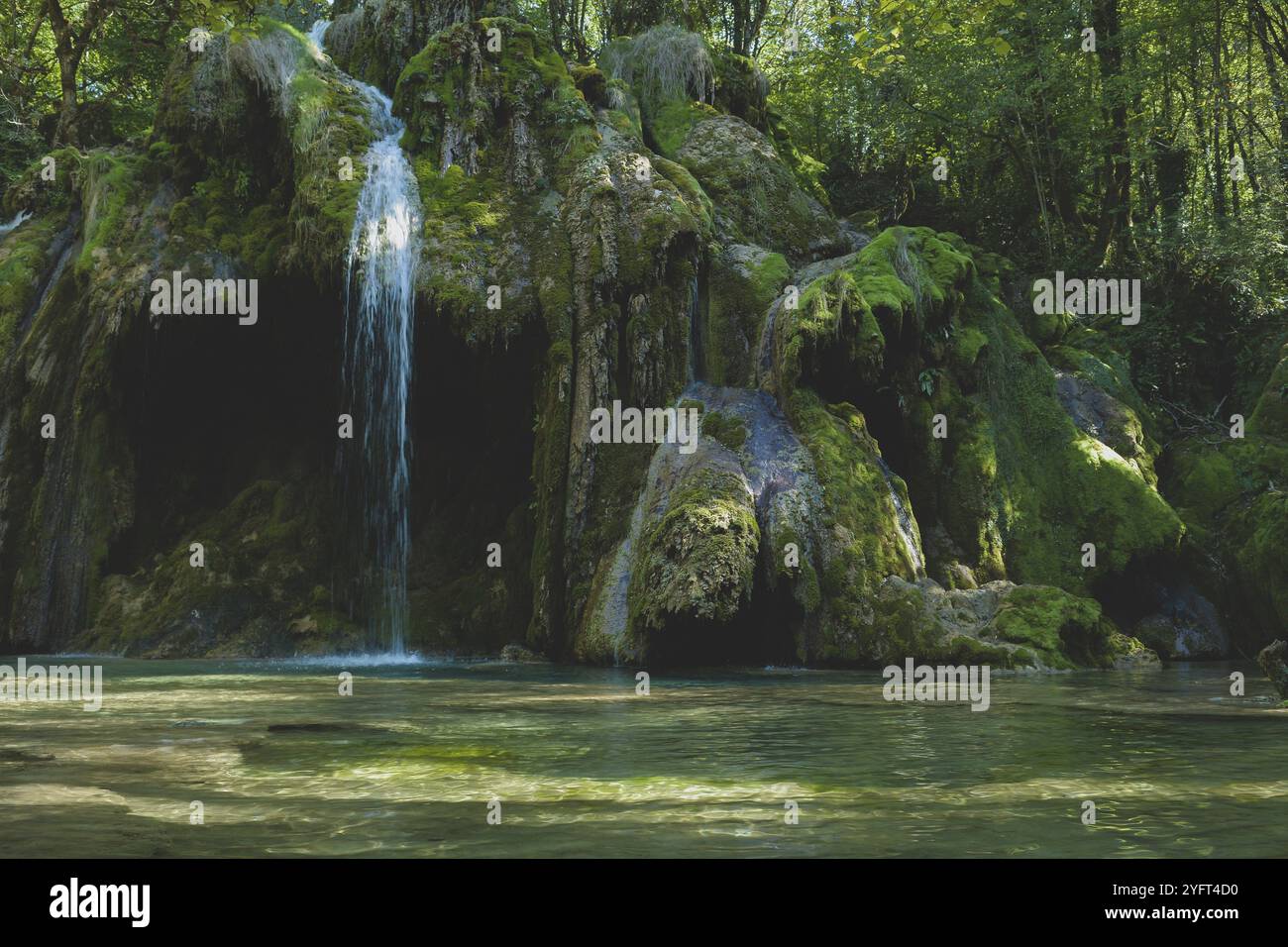 The tufa waterfall near Arbois. Crystal clear waterfall, powerful ...