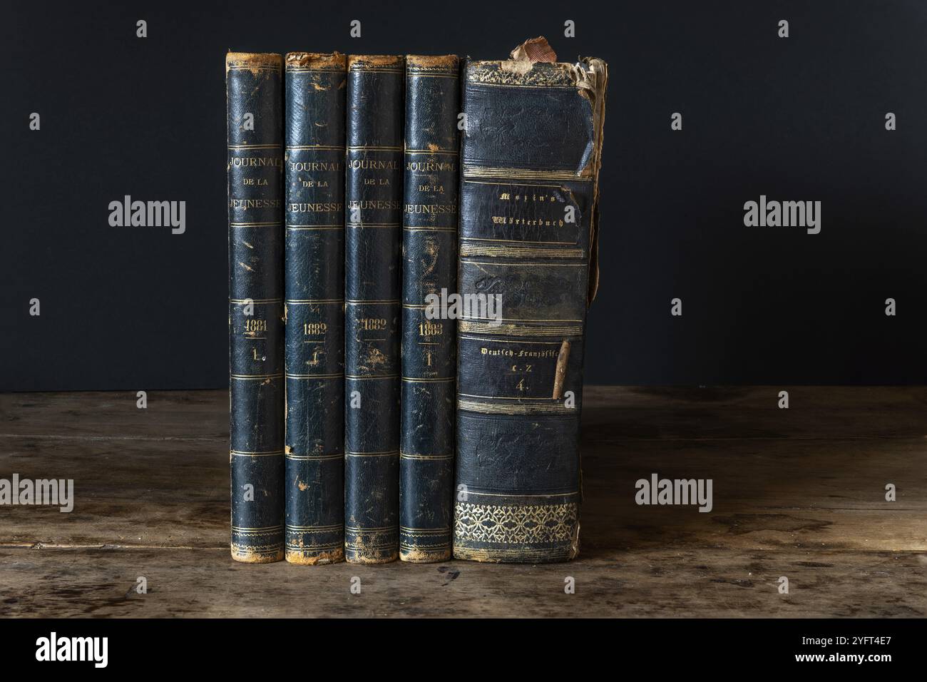 Old books on a wooden table. Classic, vintage Stock Photo - Alamy