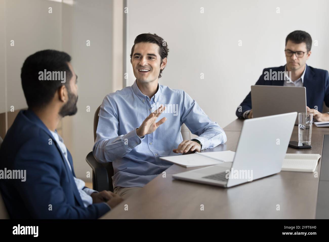 Diverse colleagues discussing office move hi-res stock photography and ...