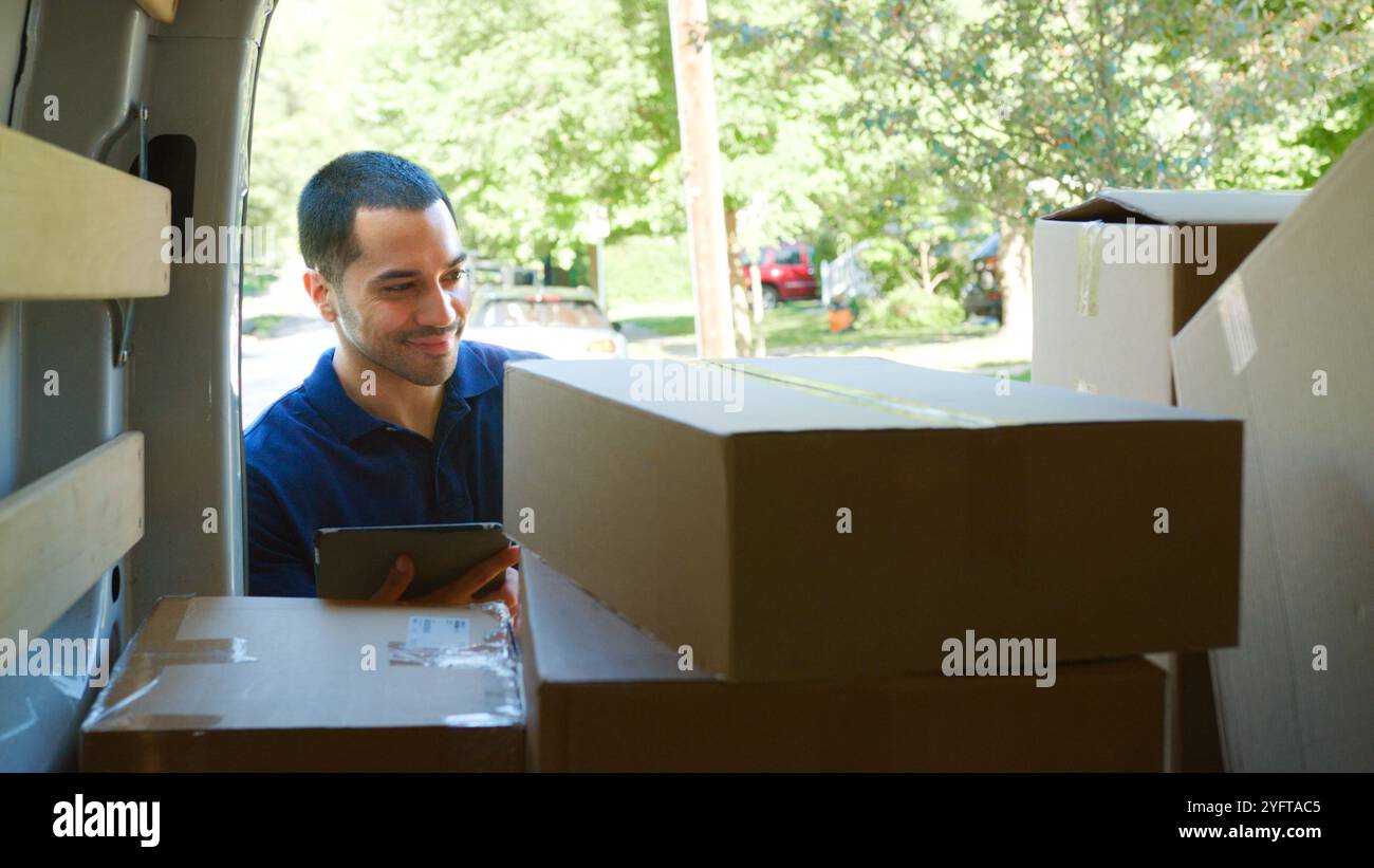 Logistics tablet man package hi-res stock photography and images - Alamy