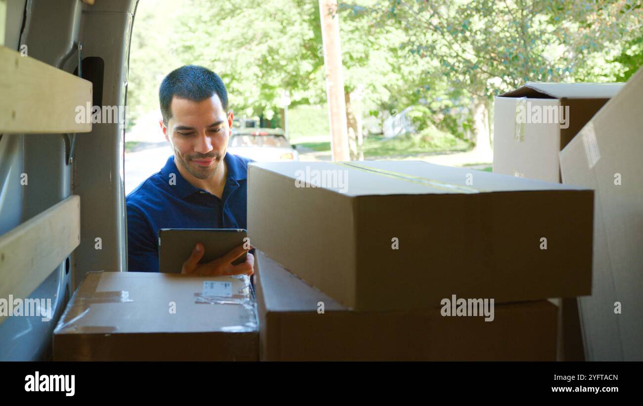 Logistics tablet man package hi-res stock photography and images - Alamy
