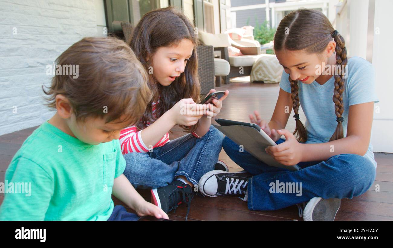 Children playing computer tablet close hi-res stock photography and ...