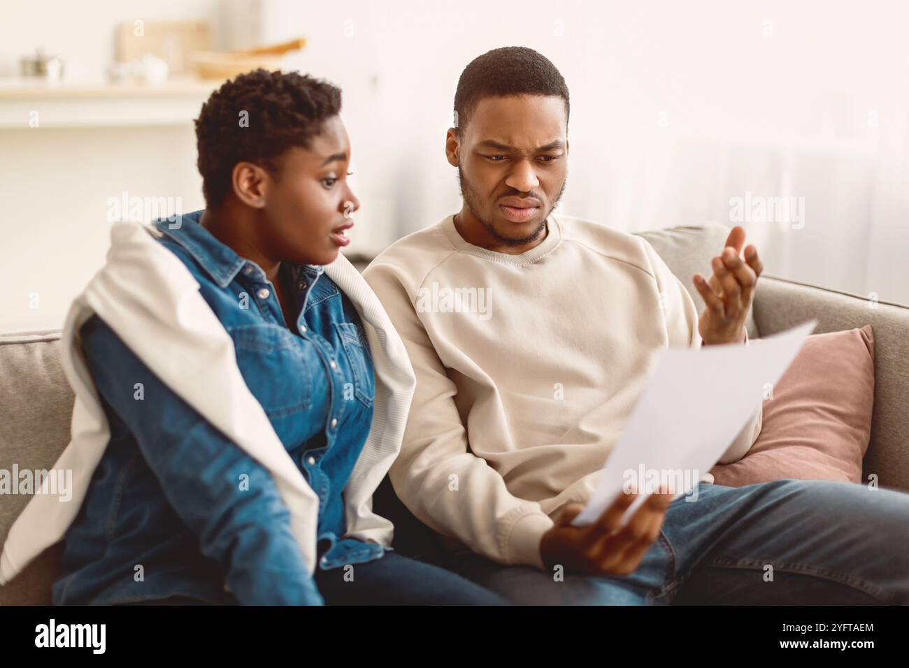 Confused man reading receipt hi-res stock photography and images - Alamy
